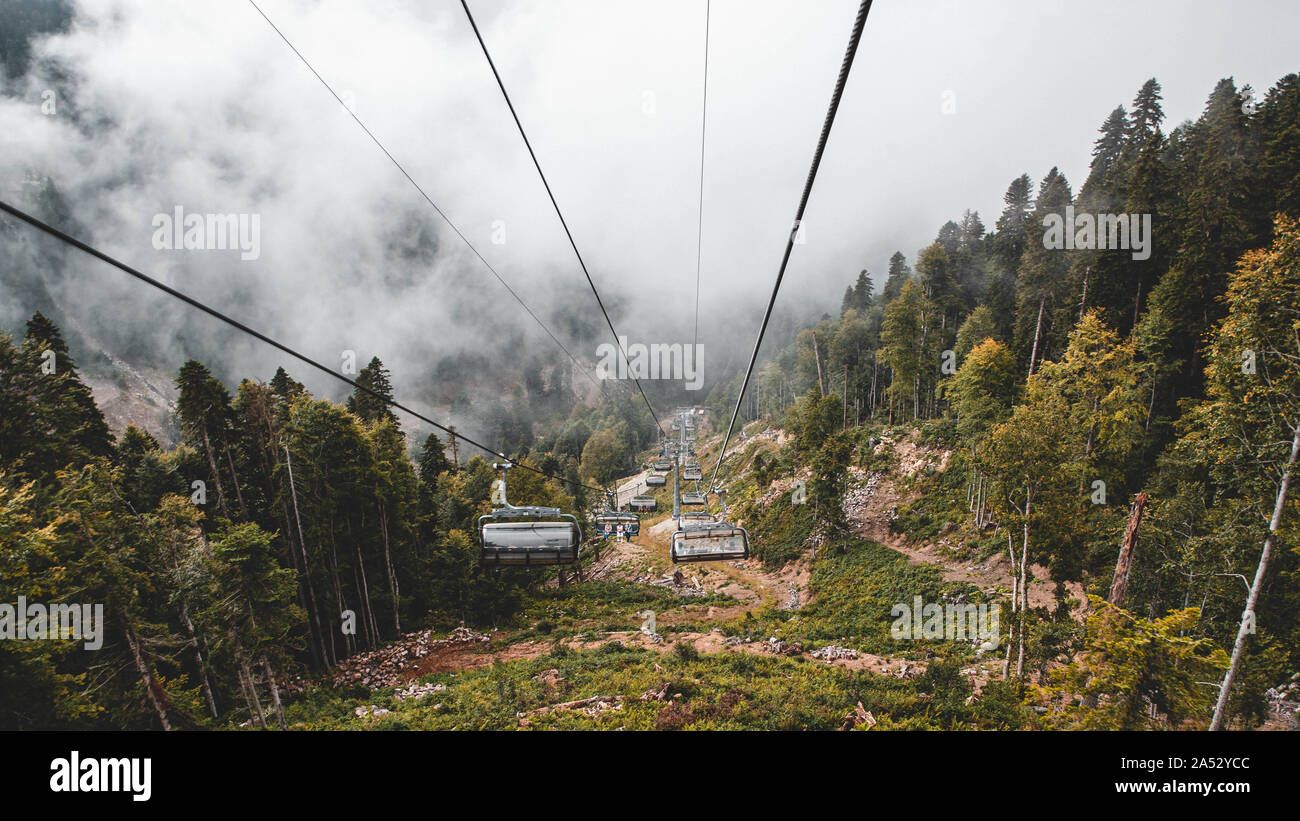 Cable car in the foggy forest Stock Photo - Alamy