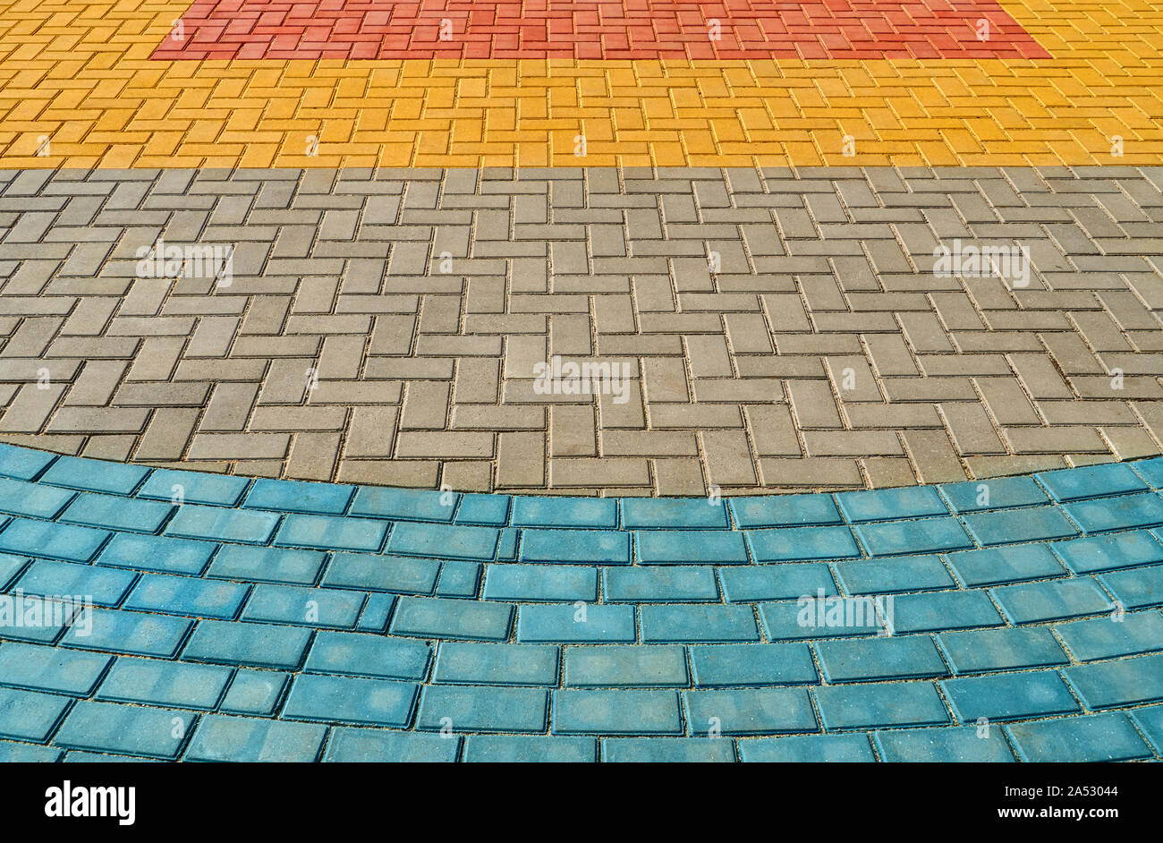 yellow, red and blue paving tiles for background or texture Stock Photo ...