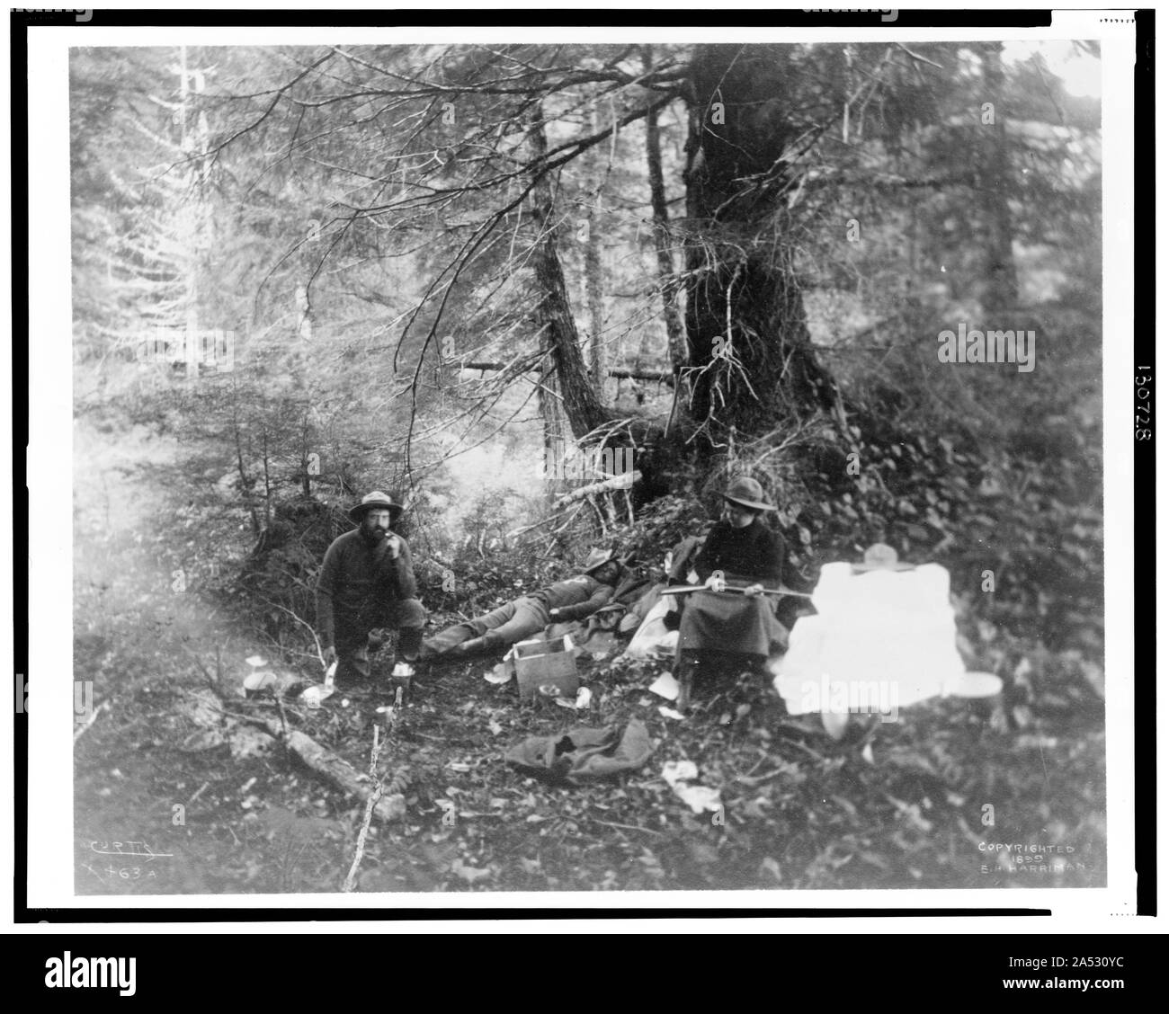 Two men and one women in forest in Alaska, 1899] / Curtis Stock Photo ...