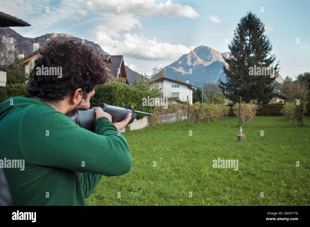 Man aiming rifle at firing range Stock Photo - Alamy