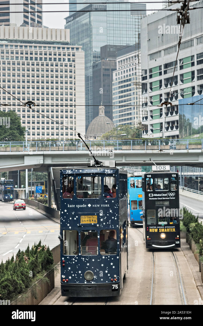 Historic double decker trams travel down Queensway Road in the central ...