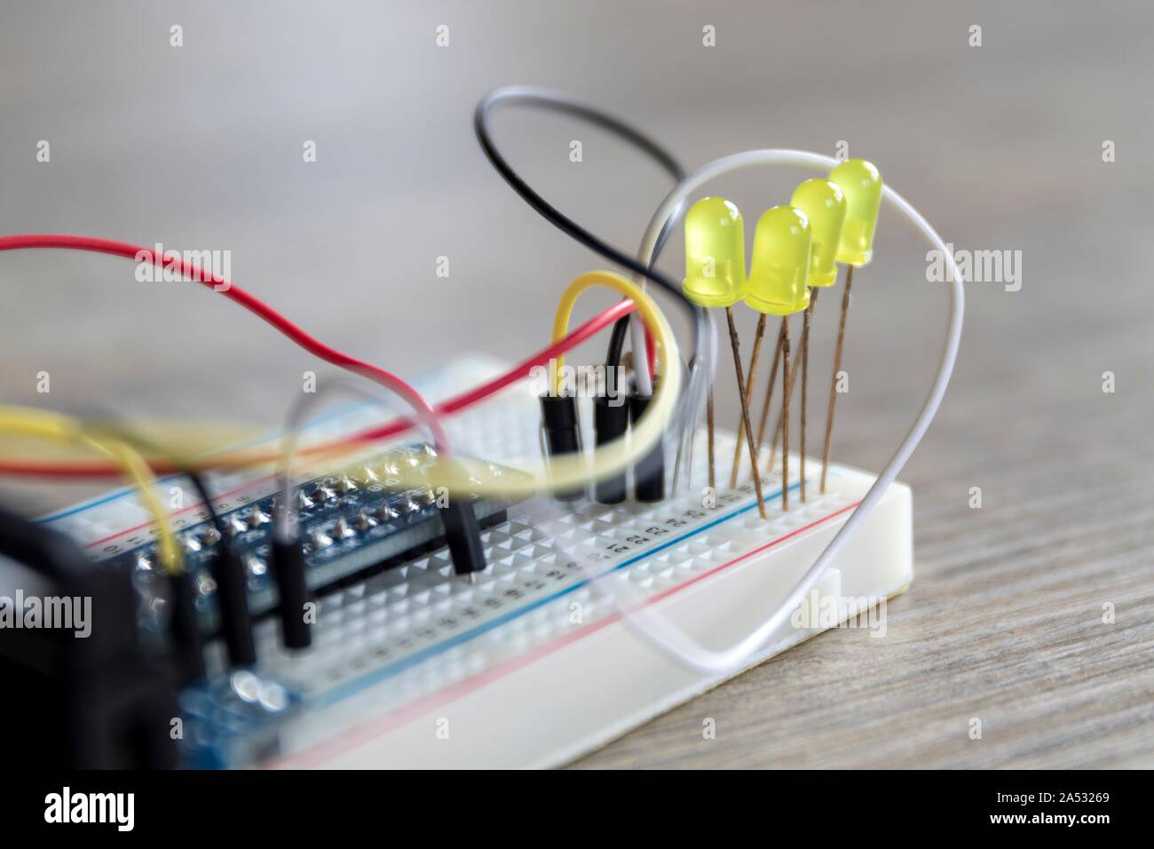 A portrait of an electronic circuit of LEDS on a breadboard with wires ...