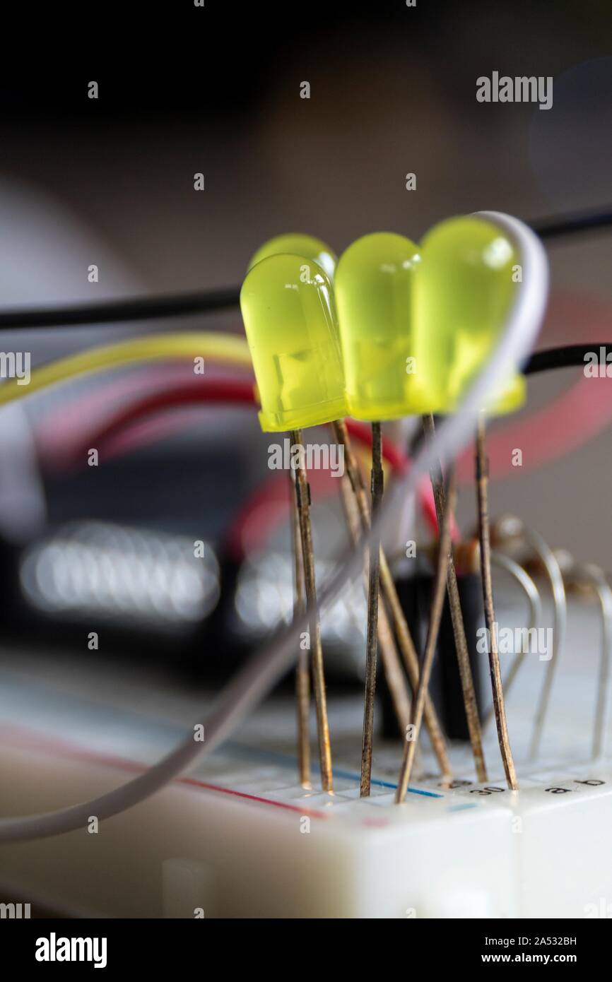 A portrait of LEDS wired into a breadboard creating an electronic ...