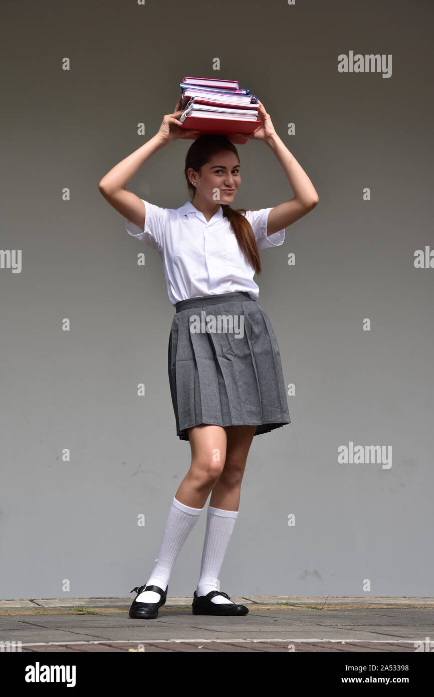 Smart Cute Girl Student With Books While Standing Stock Photo - Alamy