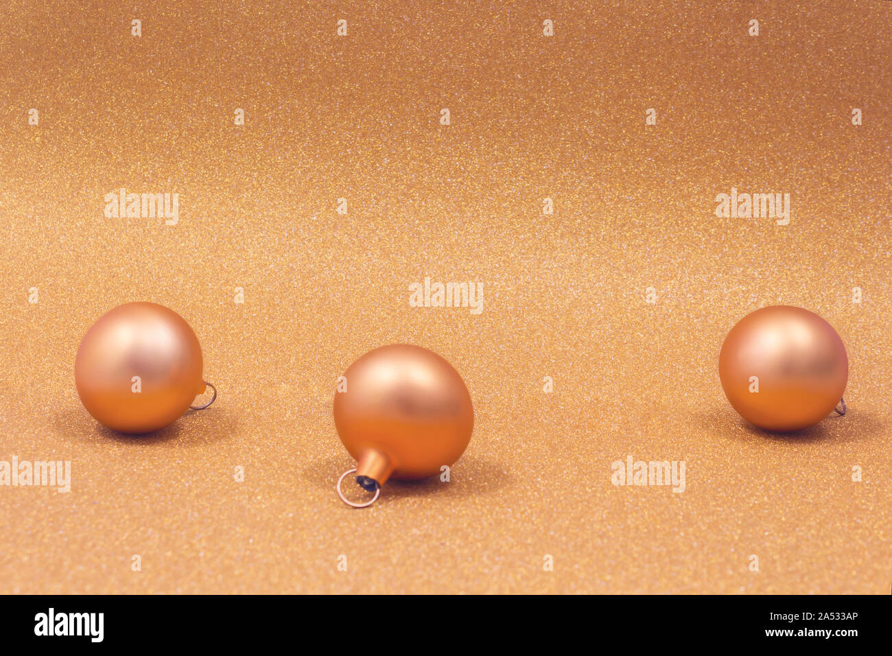 Golden Christmas balls on sparkling background. Holiday concept ...