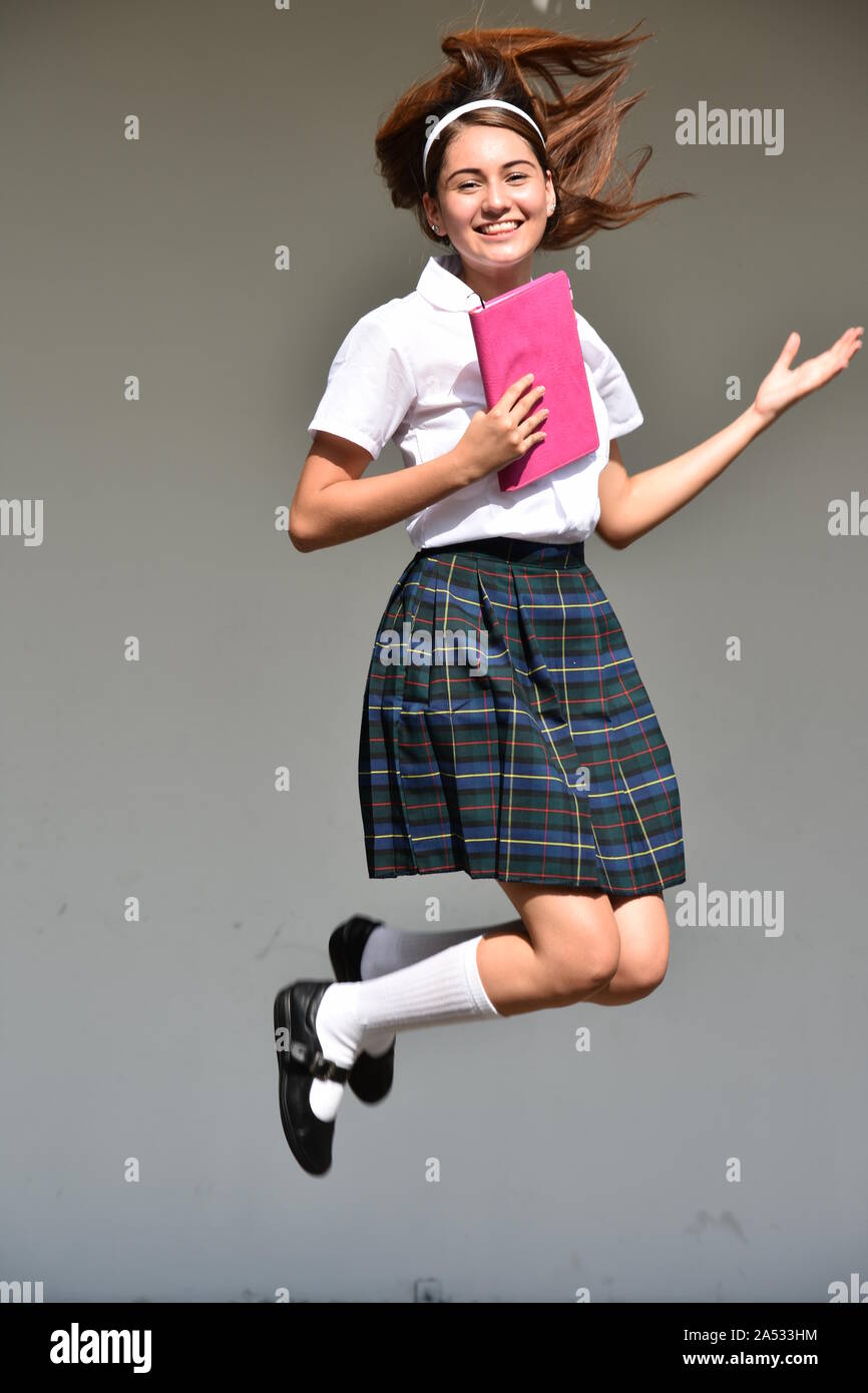 Happy Excited Girl Student Jumping Stock Photo - Alamy