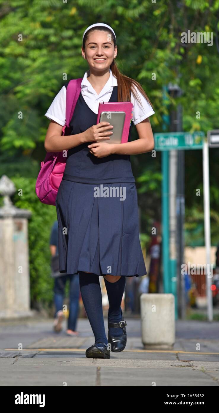 Female Student Walking To School Stock Photo - Alamy