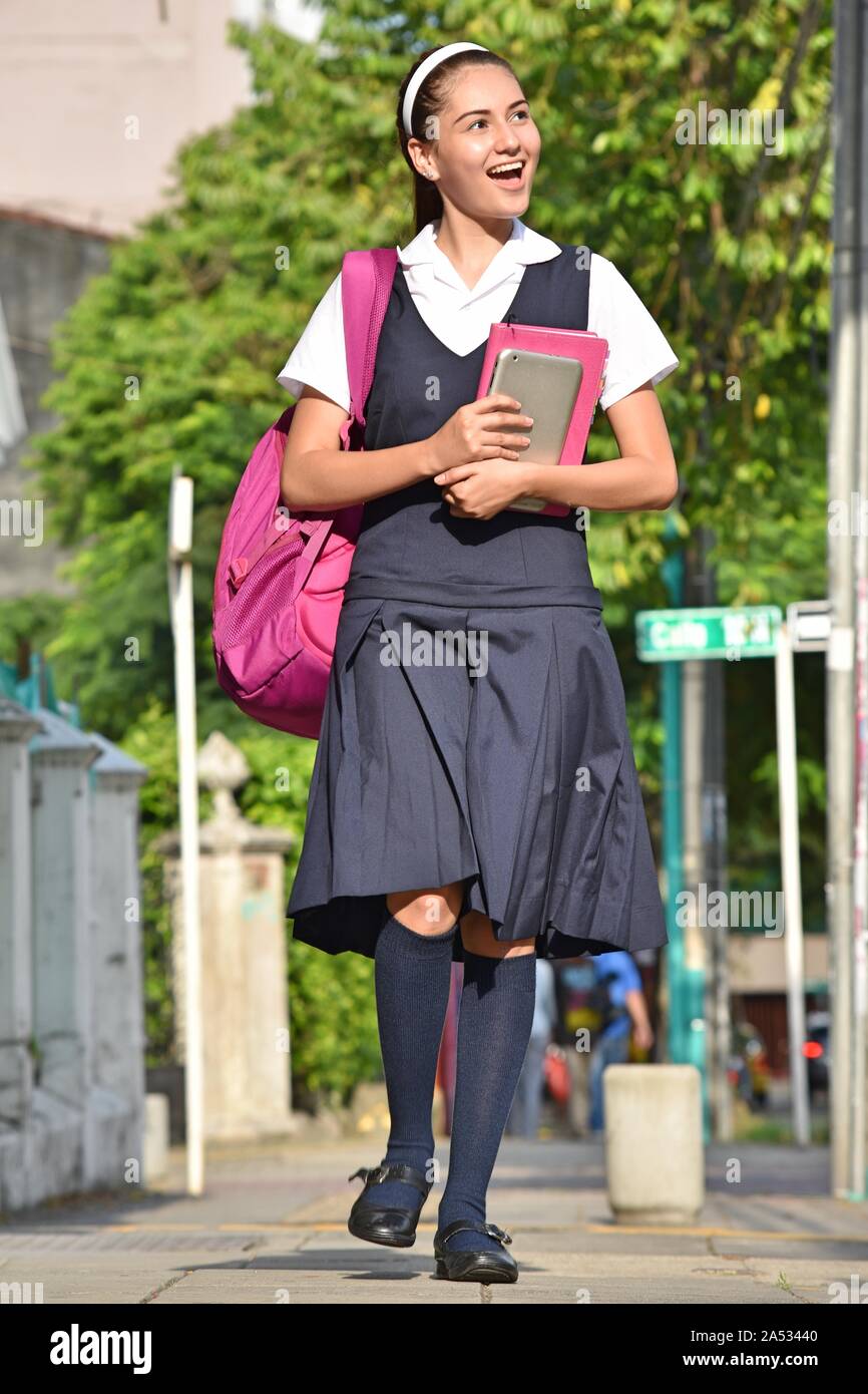Female Student Walking To School Stock Photo - Alamy