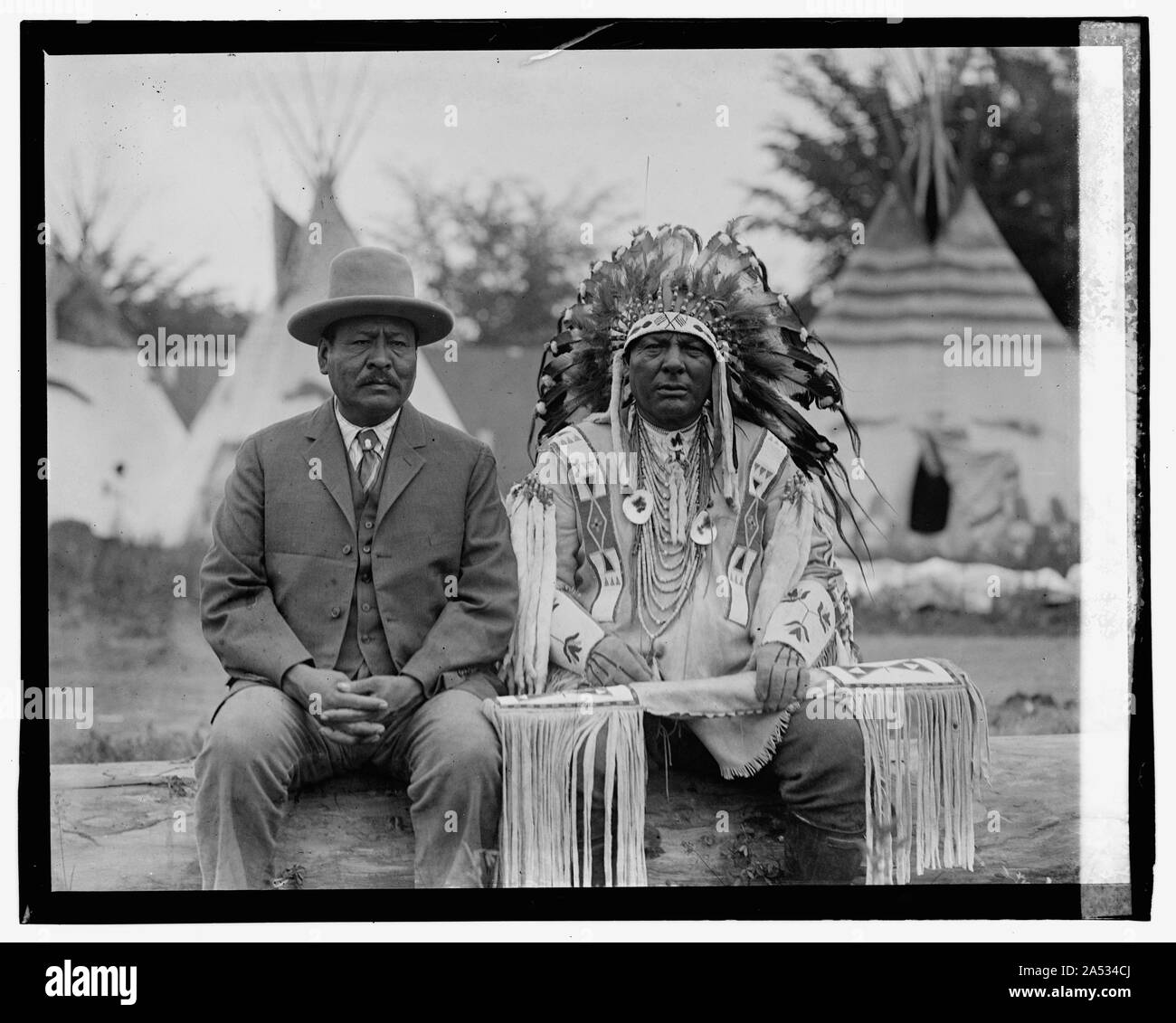 Two native american men, one in traditional dress Stock Photo - Alamy