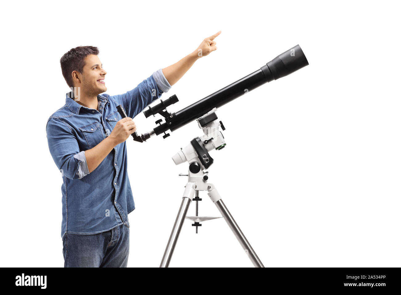 Young man standing next to a telescope and pointing up isolated on ...