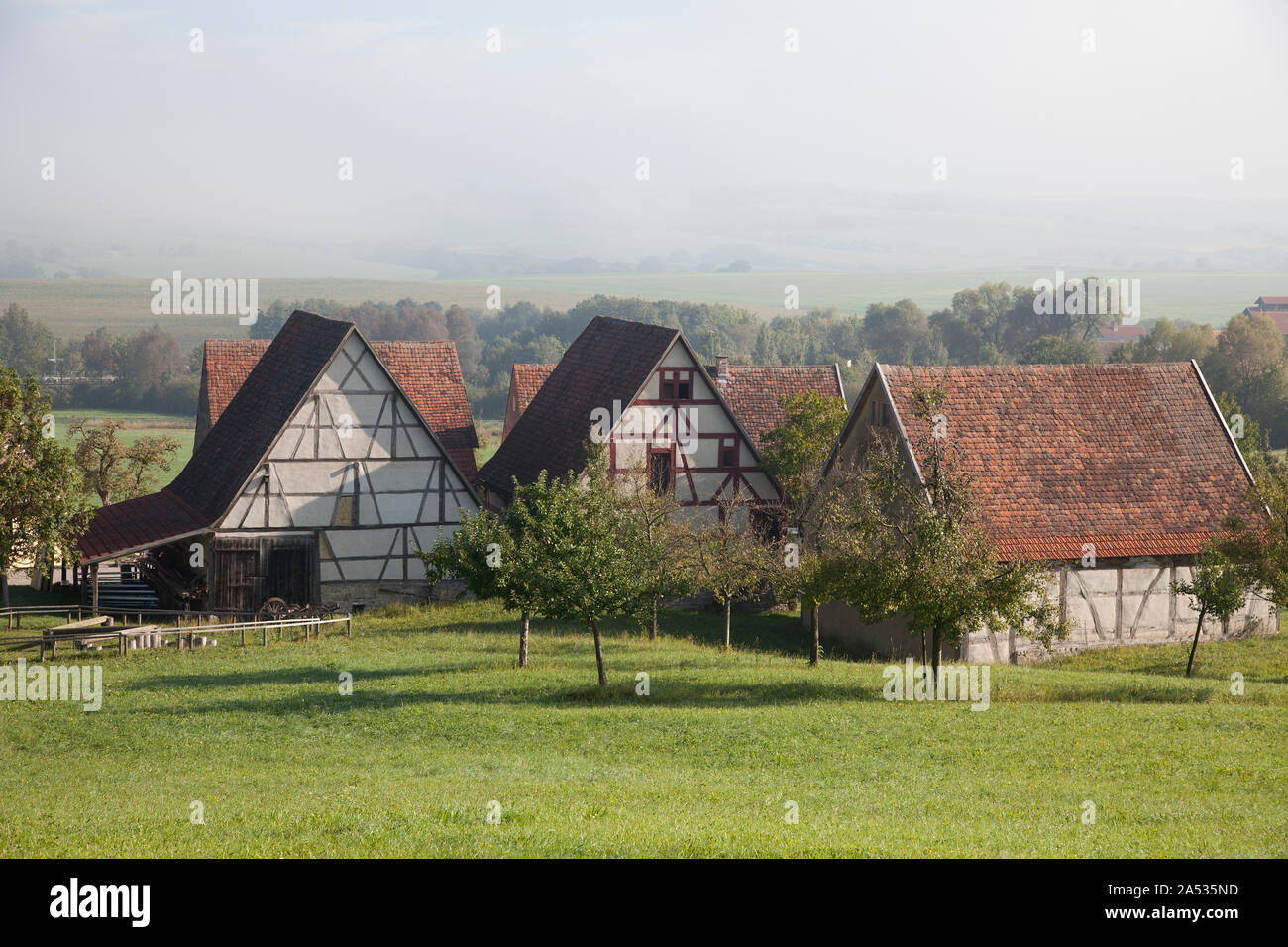 Old farm houses and barns in rural landscape Stock Photo - Alamy