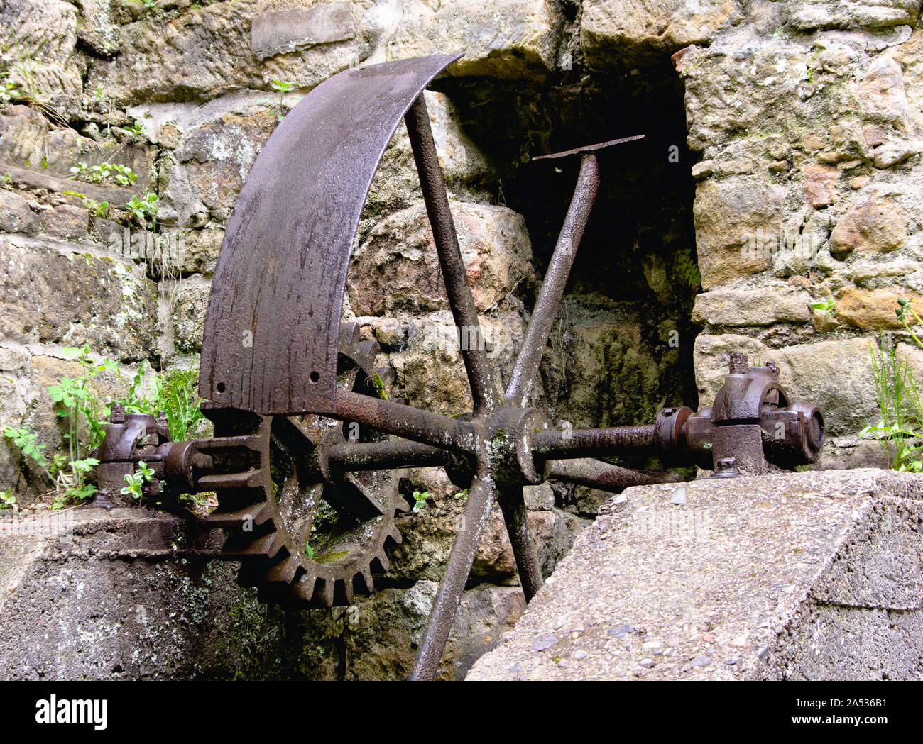 old machine parts remind of the existence of the old water mill at ...