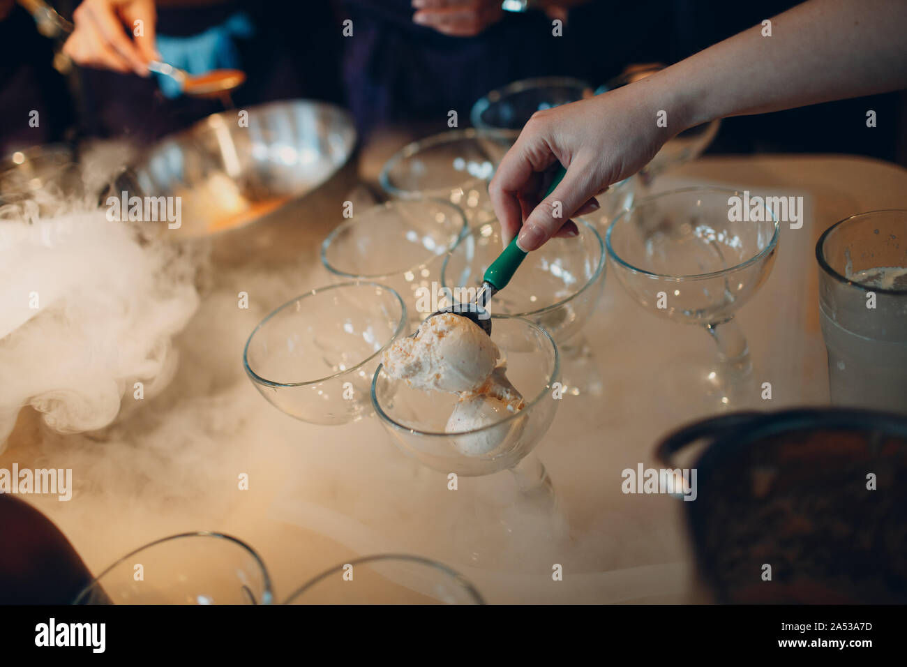 People put ice cream in creamers Stock Photo - Alamy
