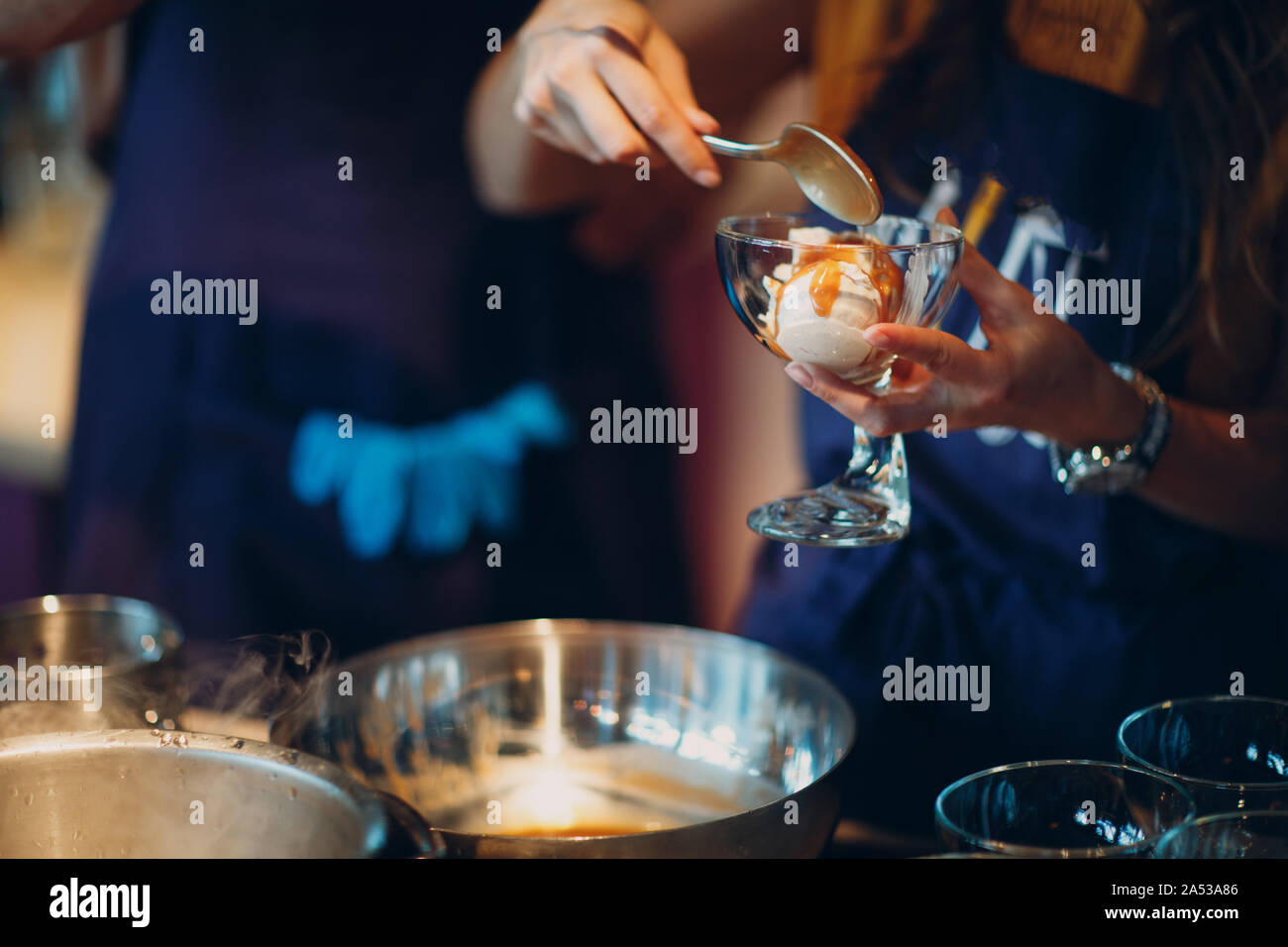 People put ice cream in creamers Stock Photo - Alamy