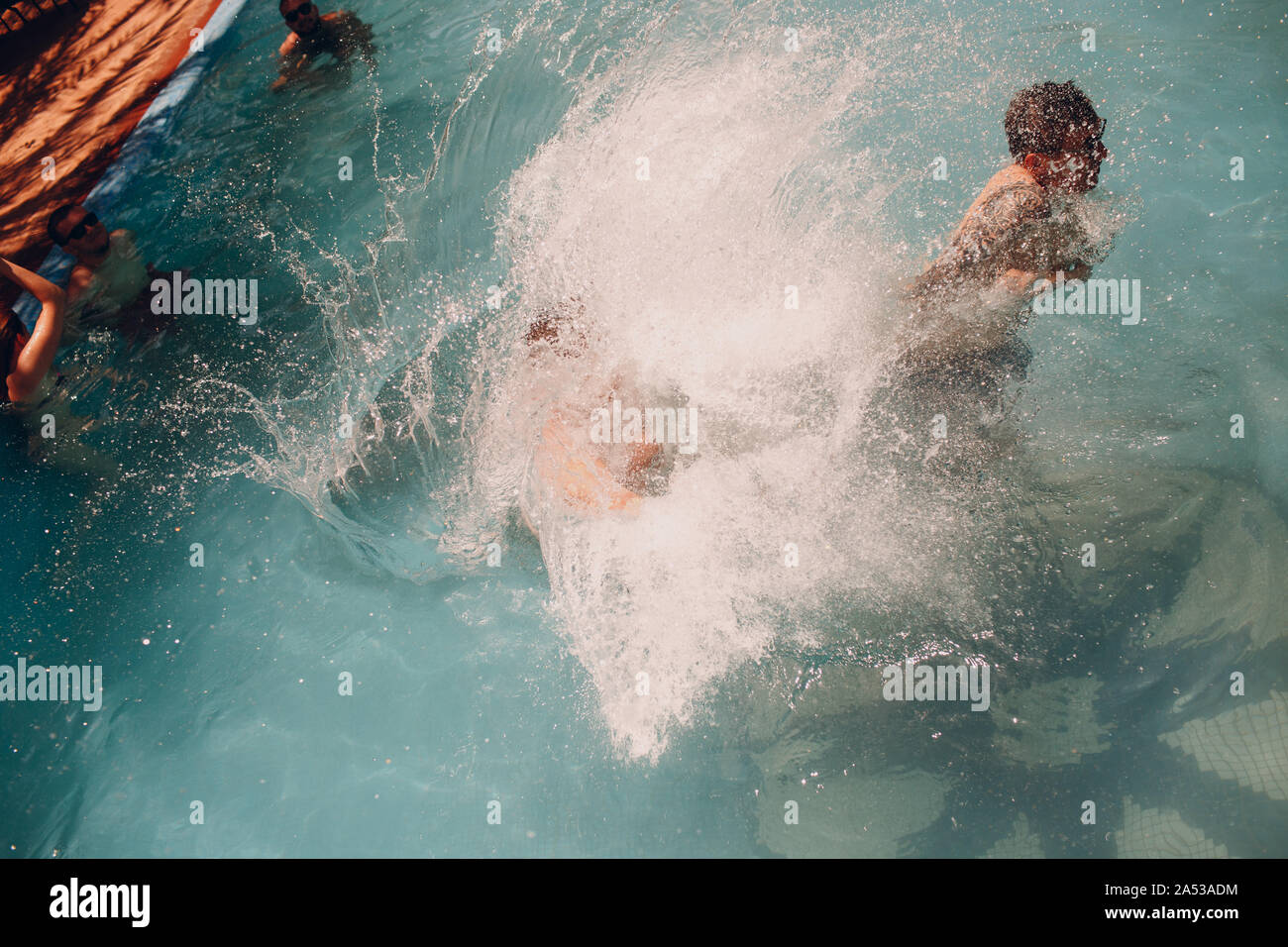 People swim and play in the pool by the hotel. Tourism concept Stock ...