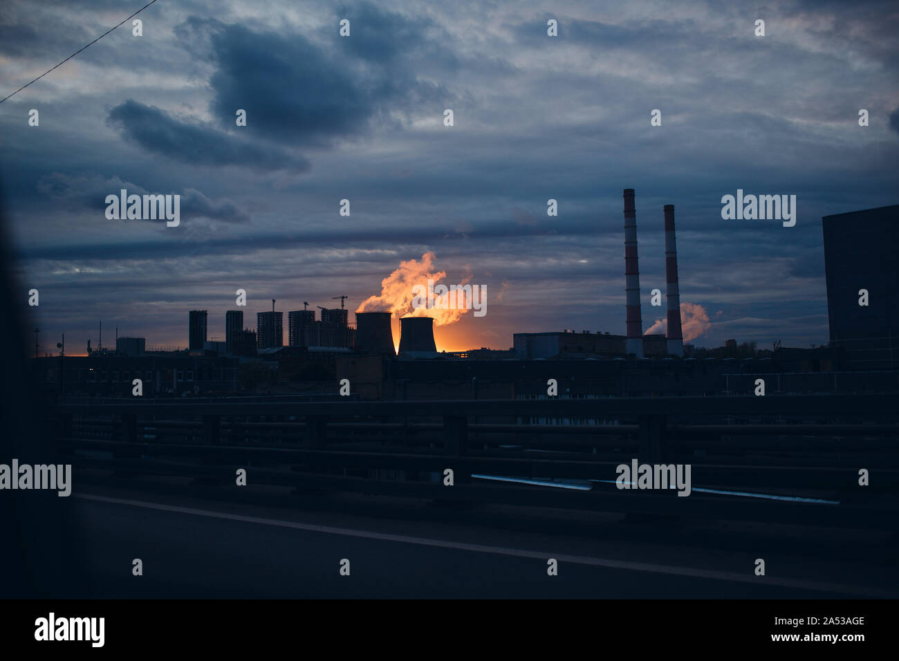 Industrial landscape and smoke from the chimneys on sunset background ...
