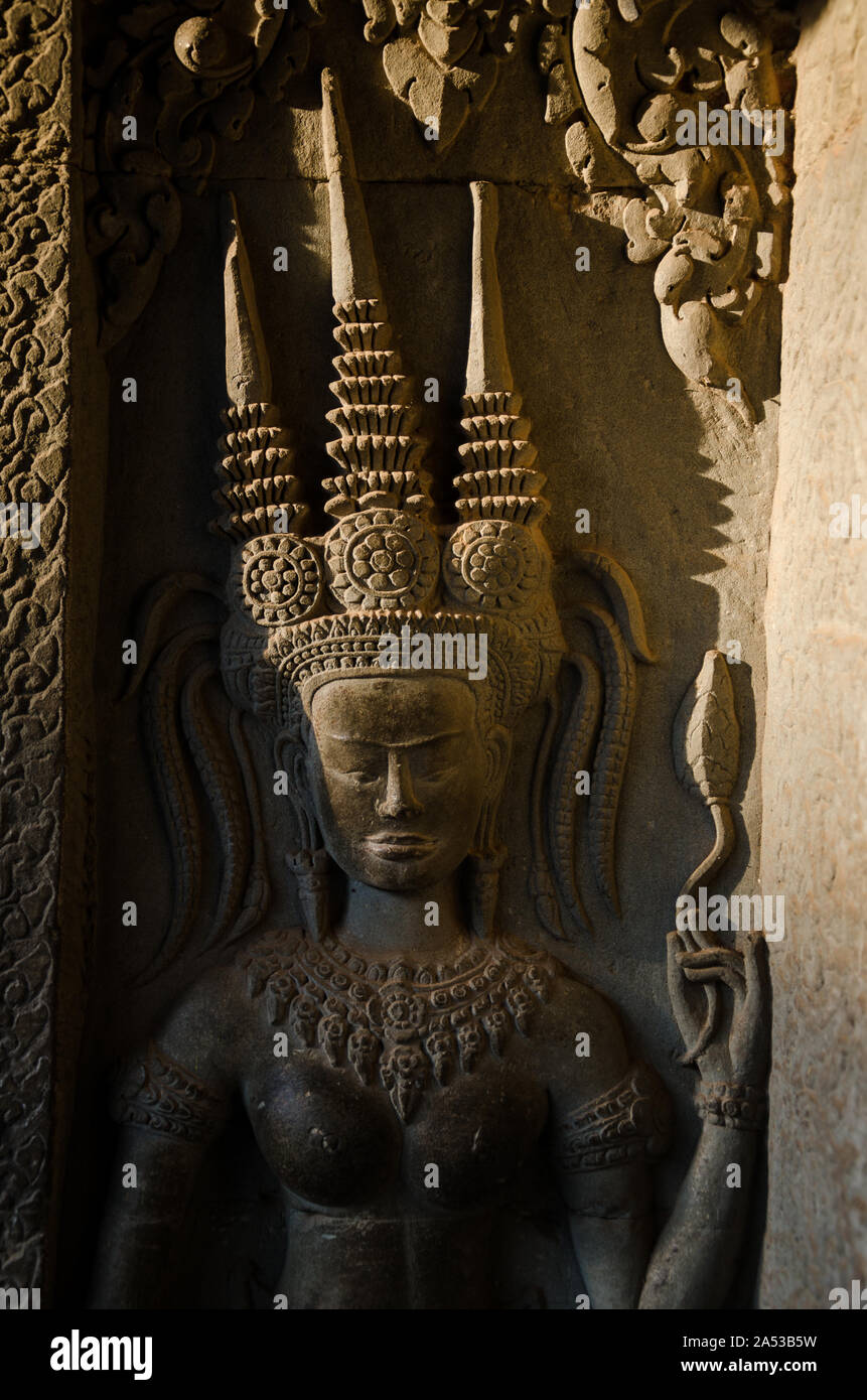 Sculptures on stone temple wall of ancient civilization in Cambodia ...