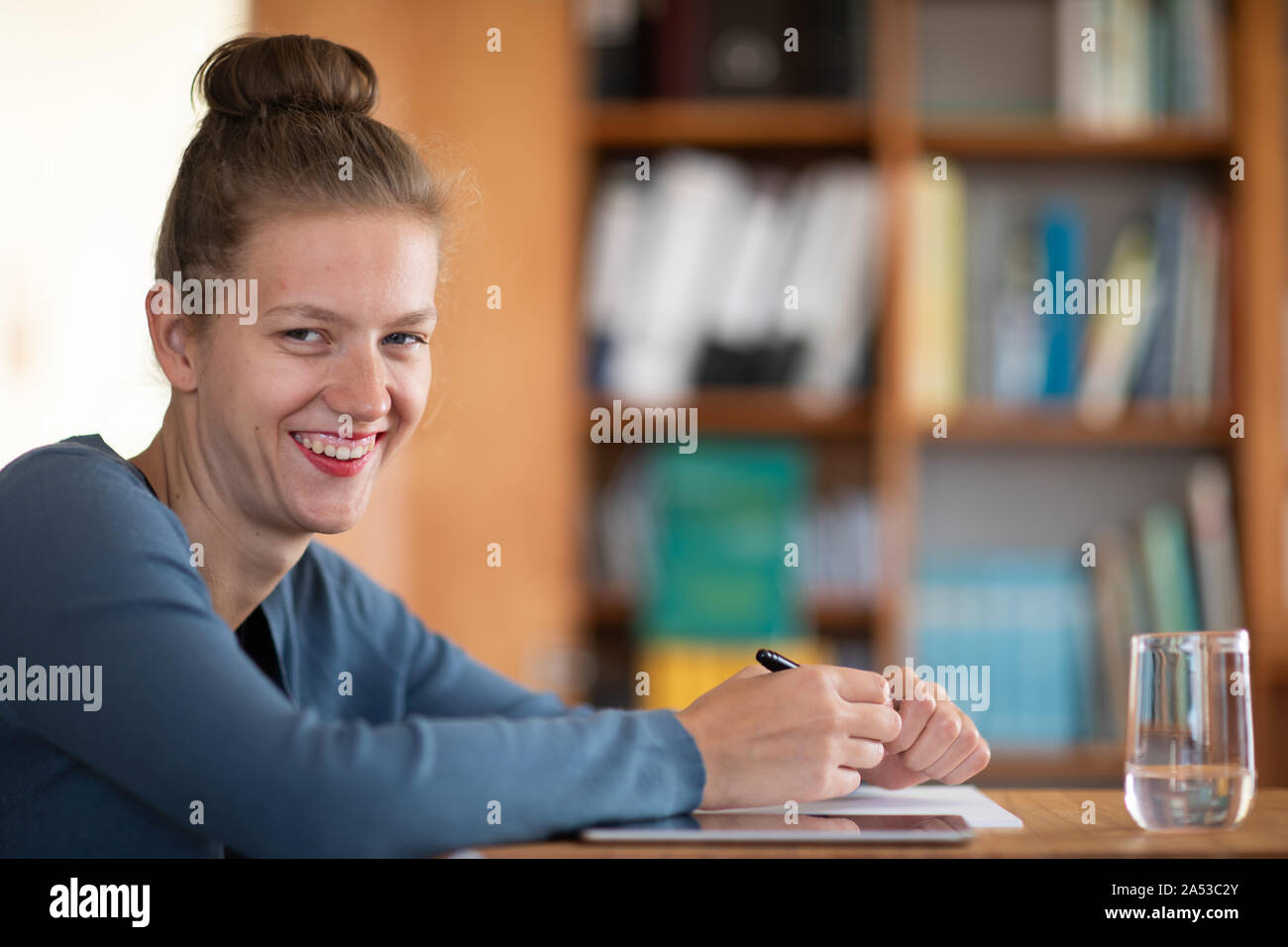 student learning in a library Stock Photo - Alamy