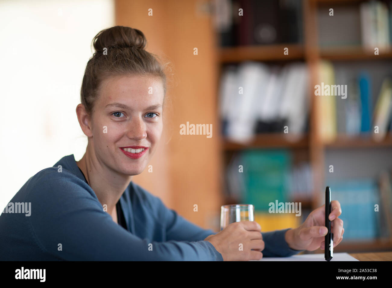 student learning in a library Stock Photo - Alamy