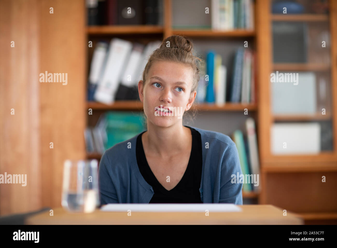 student learning in a library thinking Stock Photo - Alamy