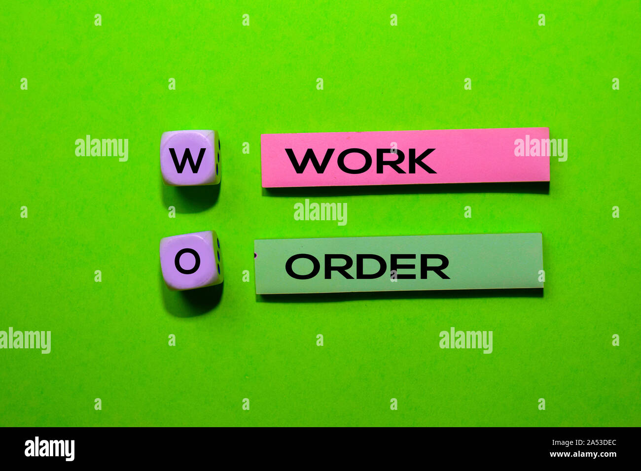 WO - Work Order acronym write on sticky notes isolated on Green ...