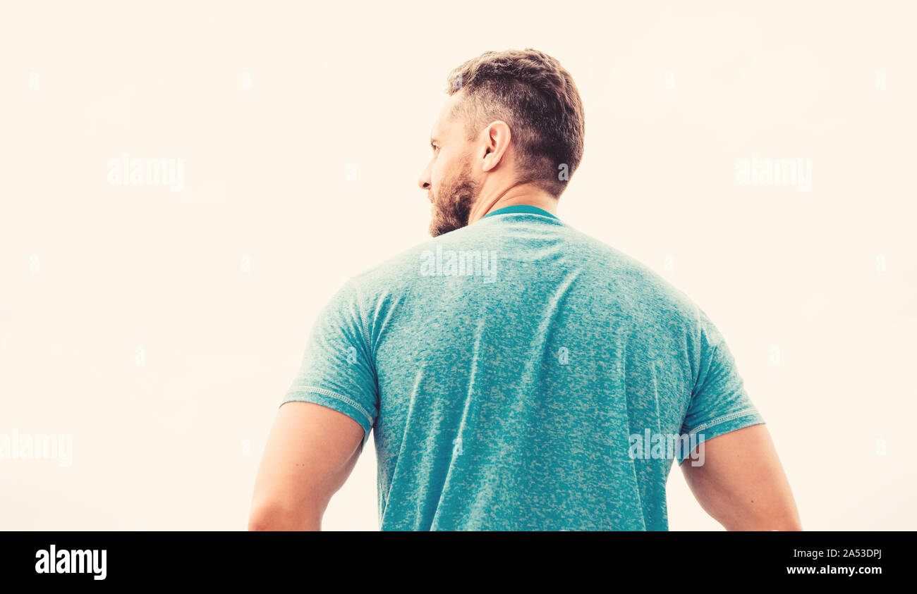 Strong muscular body feeling powerful rear view. Successful athlete ...
