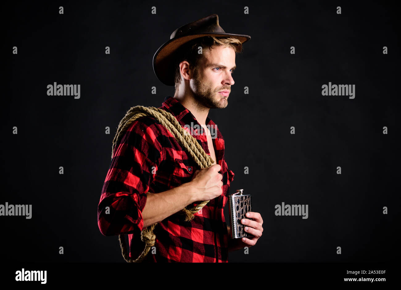 tipsy rider. cowboy with lasso rope. Western. western cowboy portrait ...