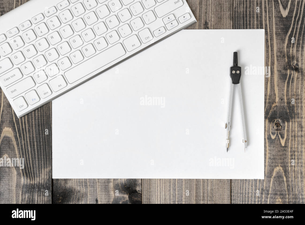 Keyboard, paper and compass on wooden plank Stock Photo - Alamy