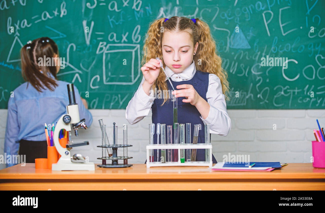 Concentrated on studying. Chemistry microscope. students doing biology ...