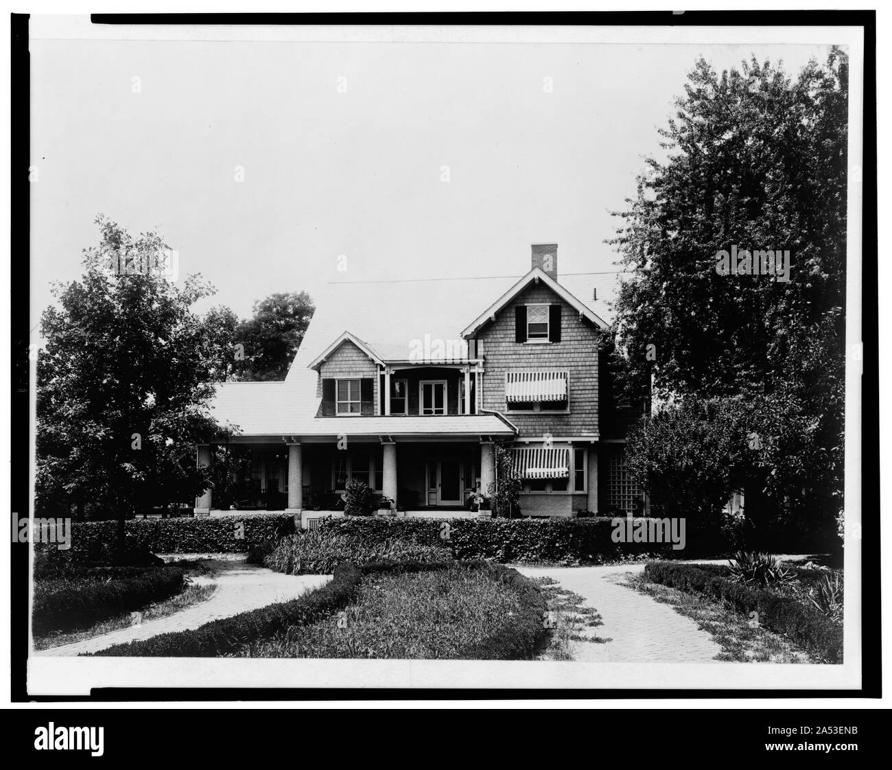 Two story frame house with porch Stock Photo - Alamy