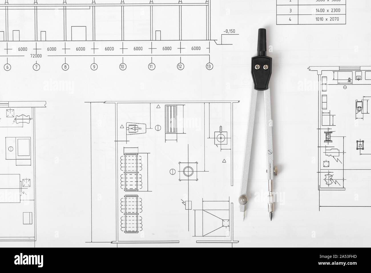 Engineering compass is on building plan Stock Photo - Alamy