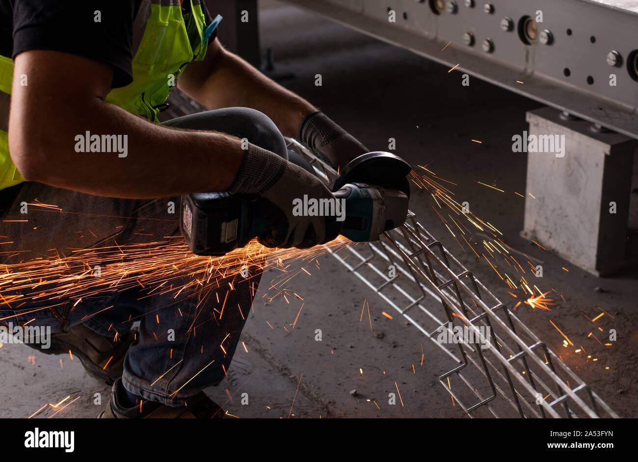 Industrial worker, cutting metal with grinder. Sparks visible. Concept ...