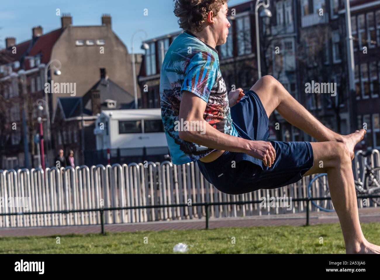 Amsterdam, Holland, February 25 2019 street flipping boy on the grass ...