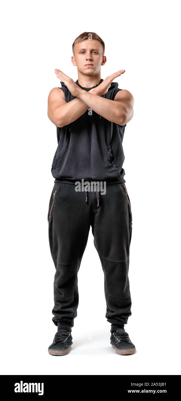 Full body portrait of handsome muscled young man making X sign with his ...
