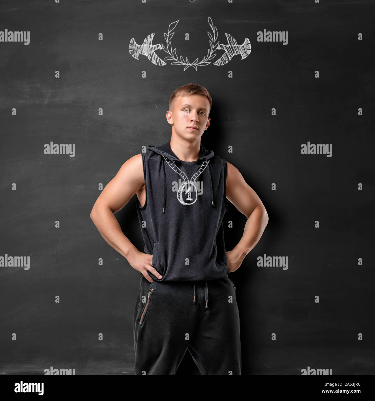 Muscled young man with laurel wreath above his head and a medal on neck ...