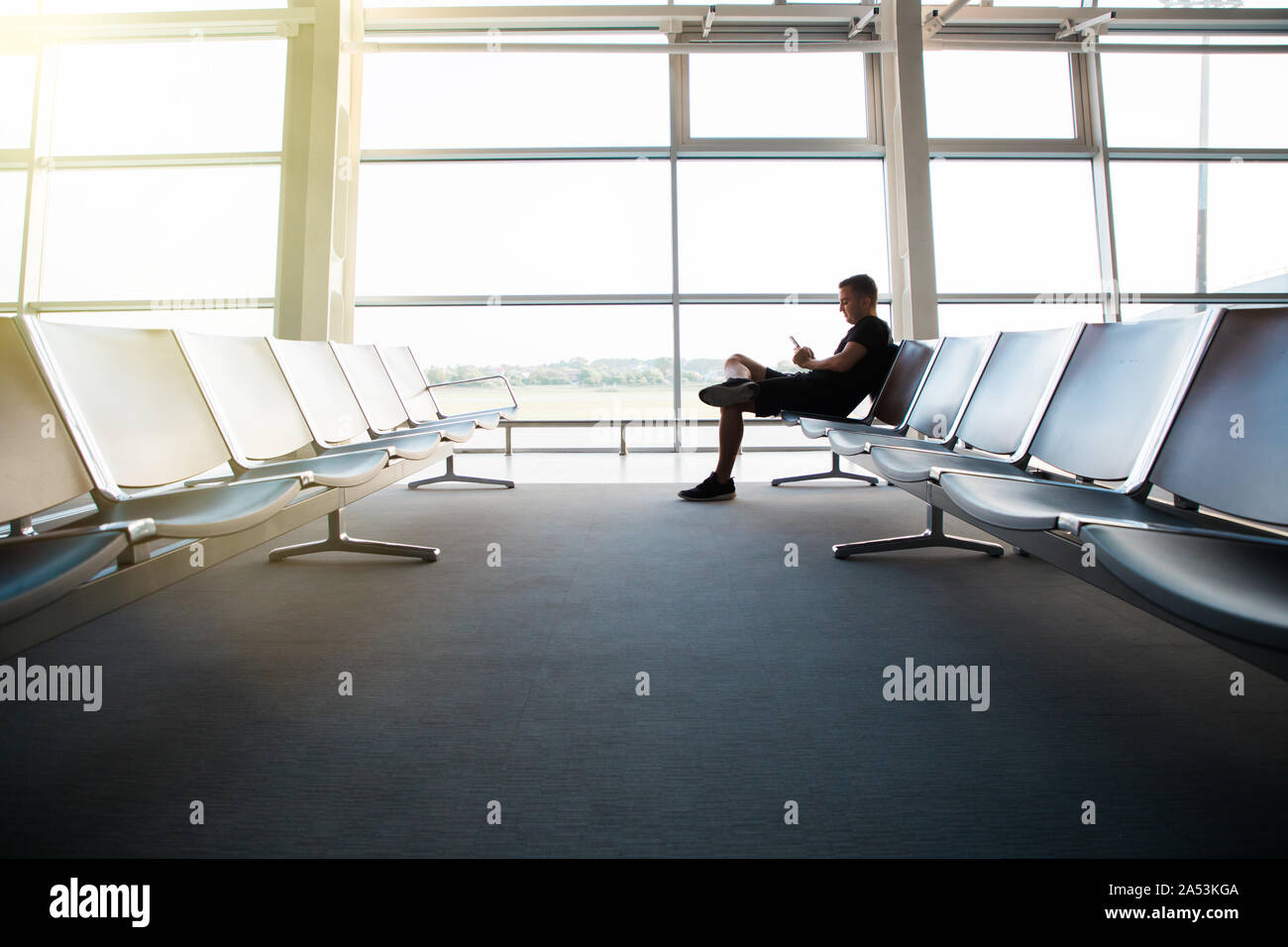 Portrait of young handsome man wearing casual style clothes sitting on ...