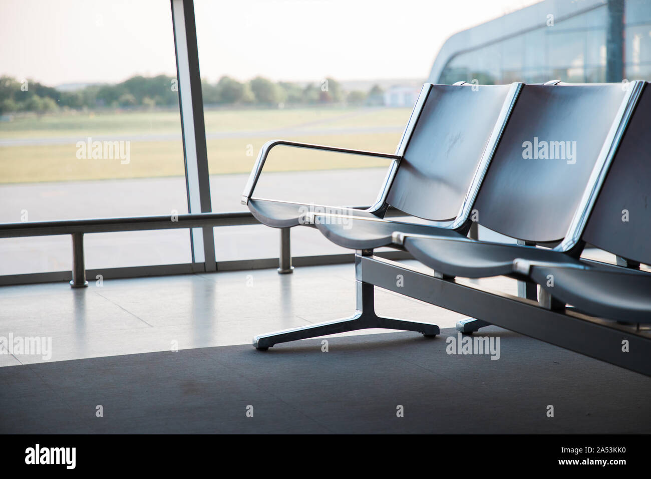 Waiting area in an empty airport terminal Stock Photo - Alamy