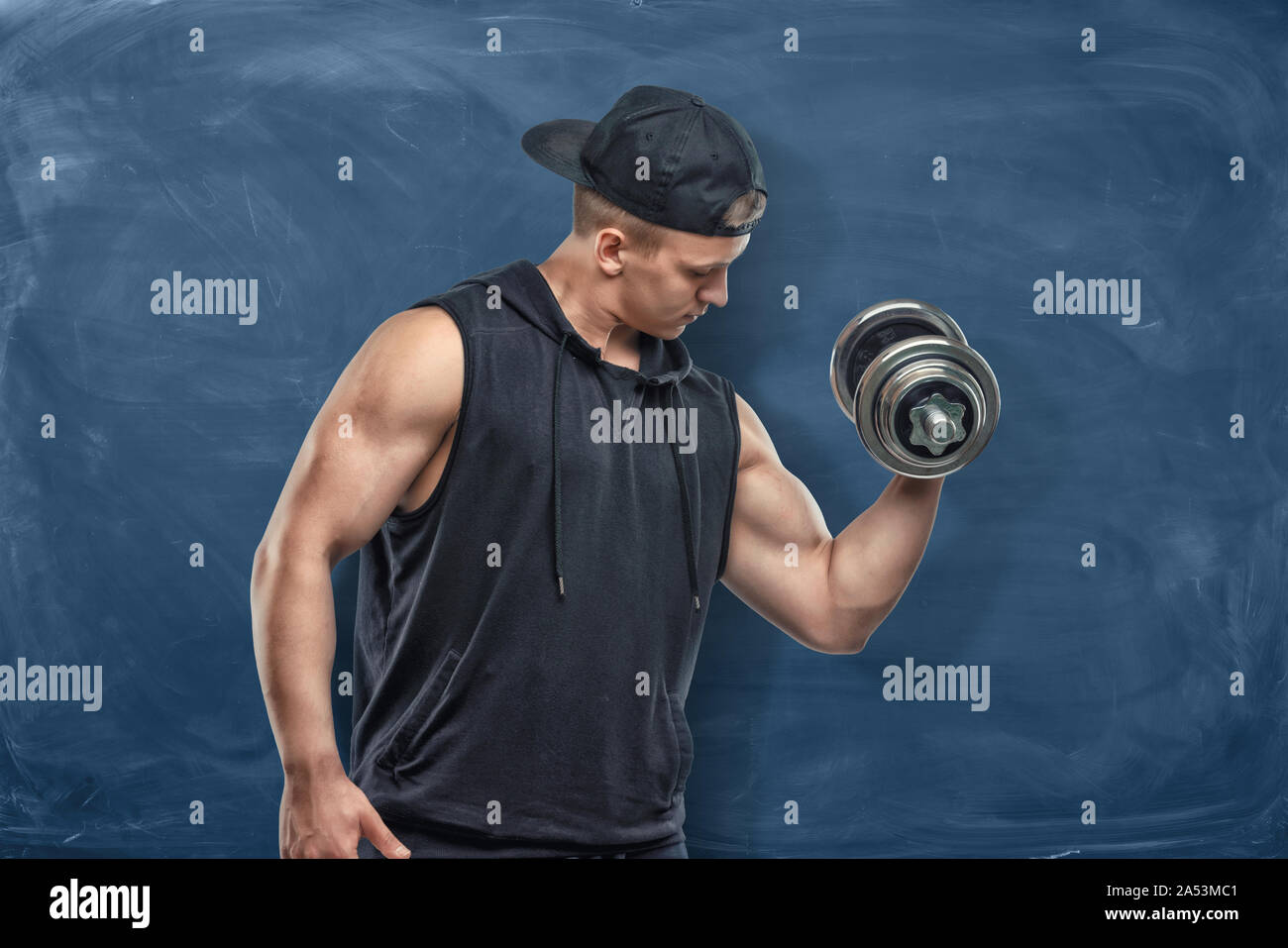 Portrait of young handsome man in black outfit standing and showing his ...