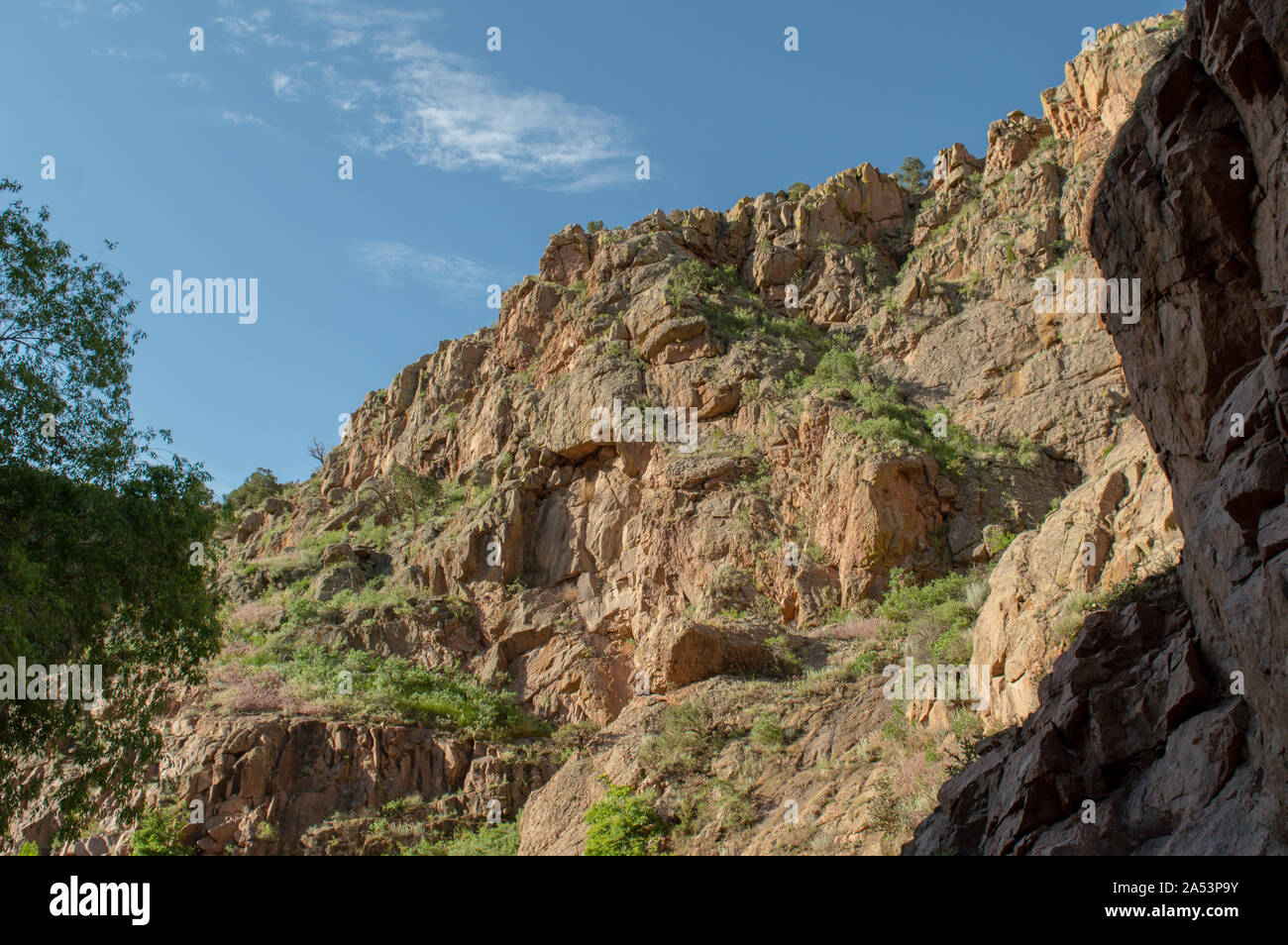 The ridge of this Colorado mountain almost reaches into the pretty blue ...