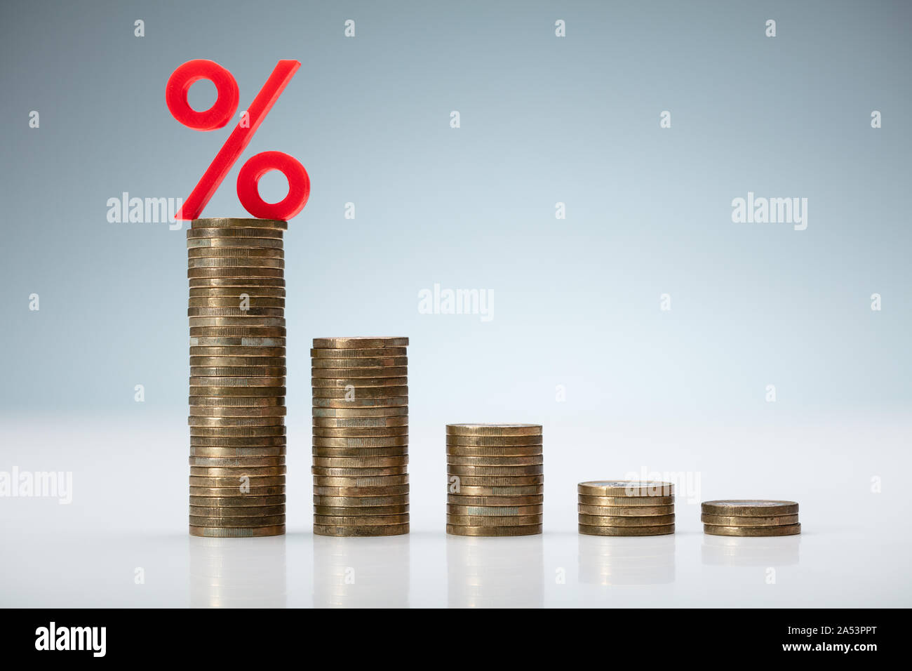 Interest Rate Decreasing Graph Made Of Stacked Coins Stock Photo - Alamy