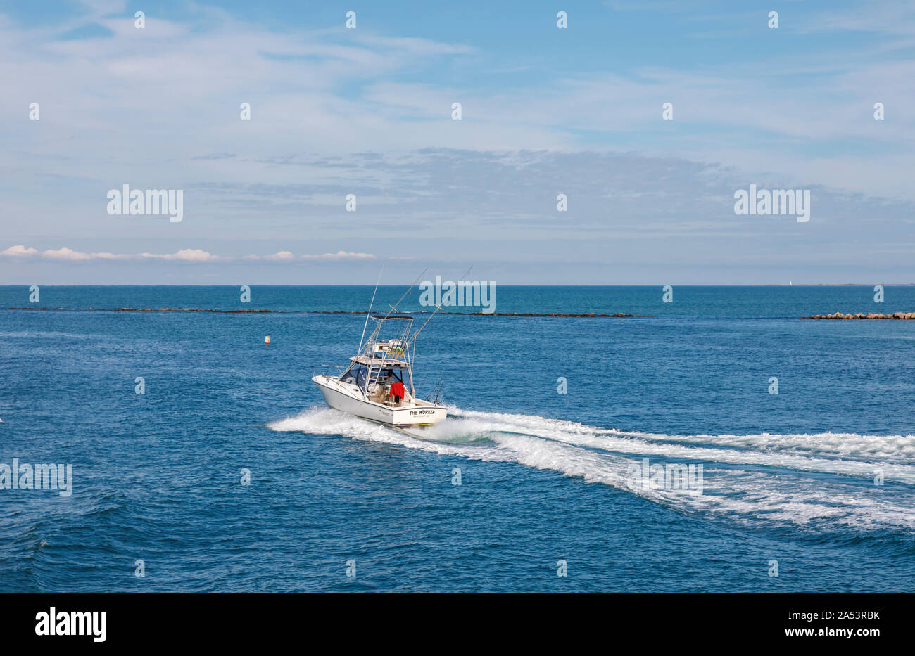 A high speed sport fishing charter boat departs towards Nantucket Sound ...