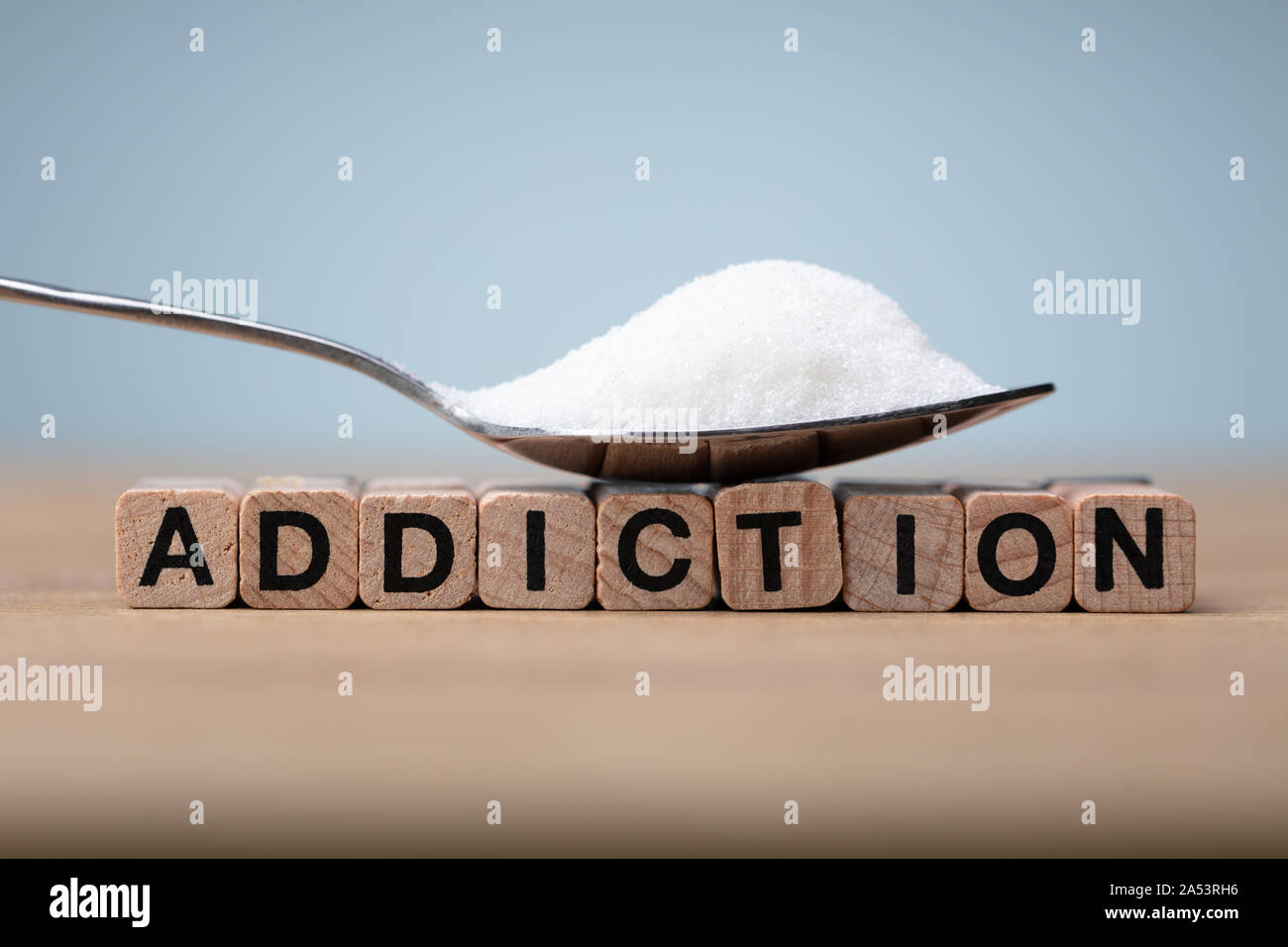 Addiction Word Near Spoon Of Sugar On Table Stock Photo - Alamy