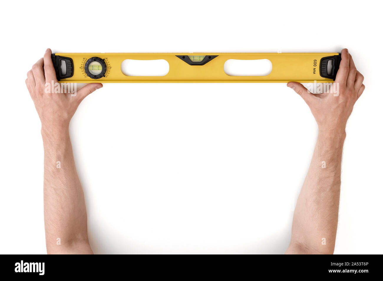 Close-up view of man's hands holding yellow building level isolated on ...