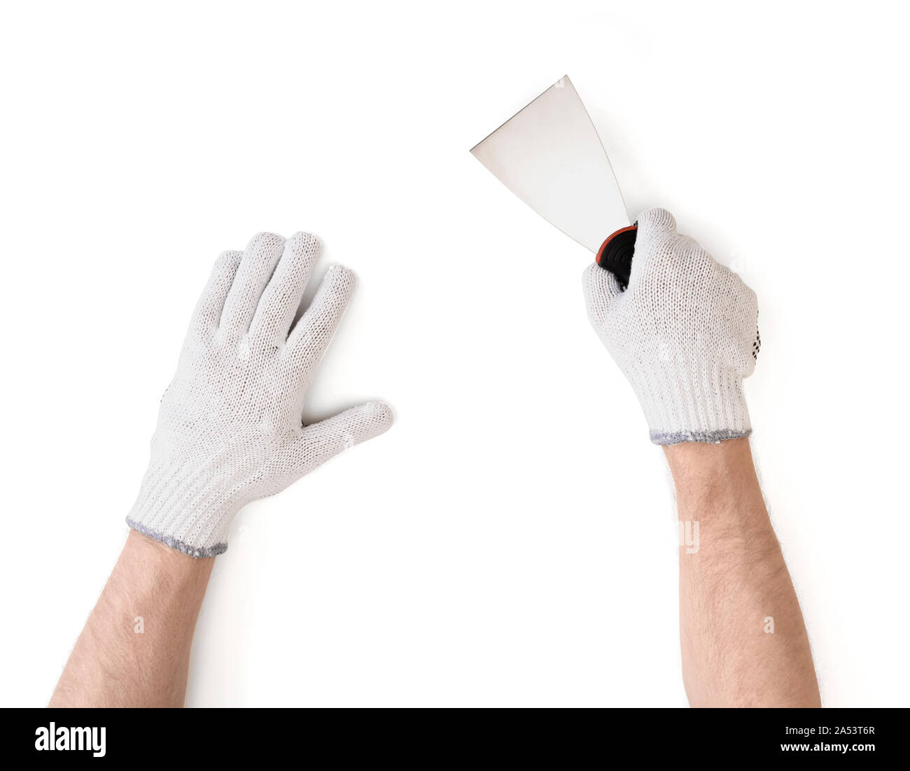 Close-up view of man's hands in white cotton gloves with putty knife ...