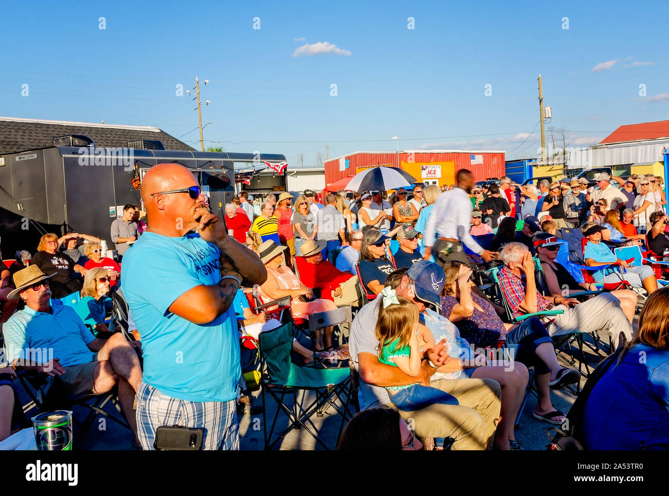 Mexico Beach residents, many wearing Mexico Beach Strong shirts, listen ...