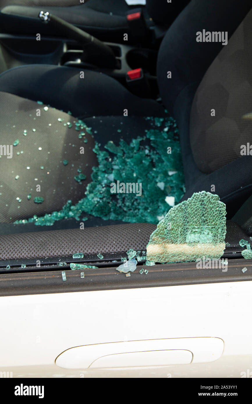 Car with broken driver side window Stock Photo - Alamy