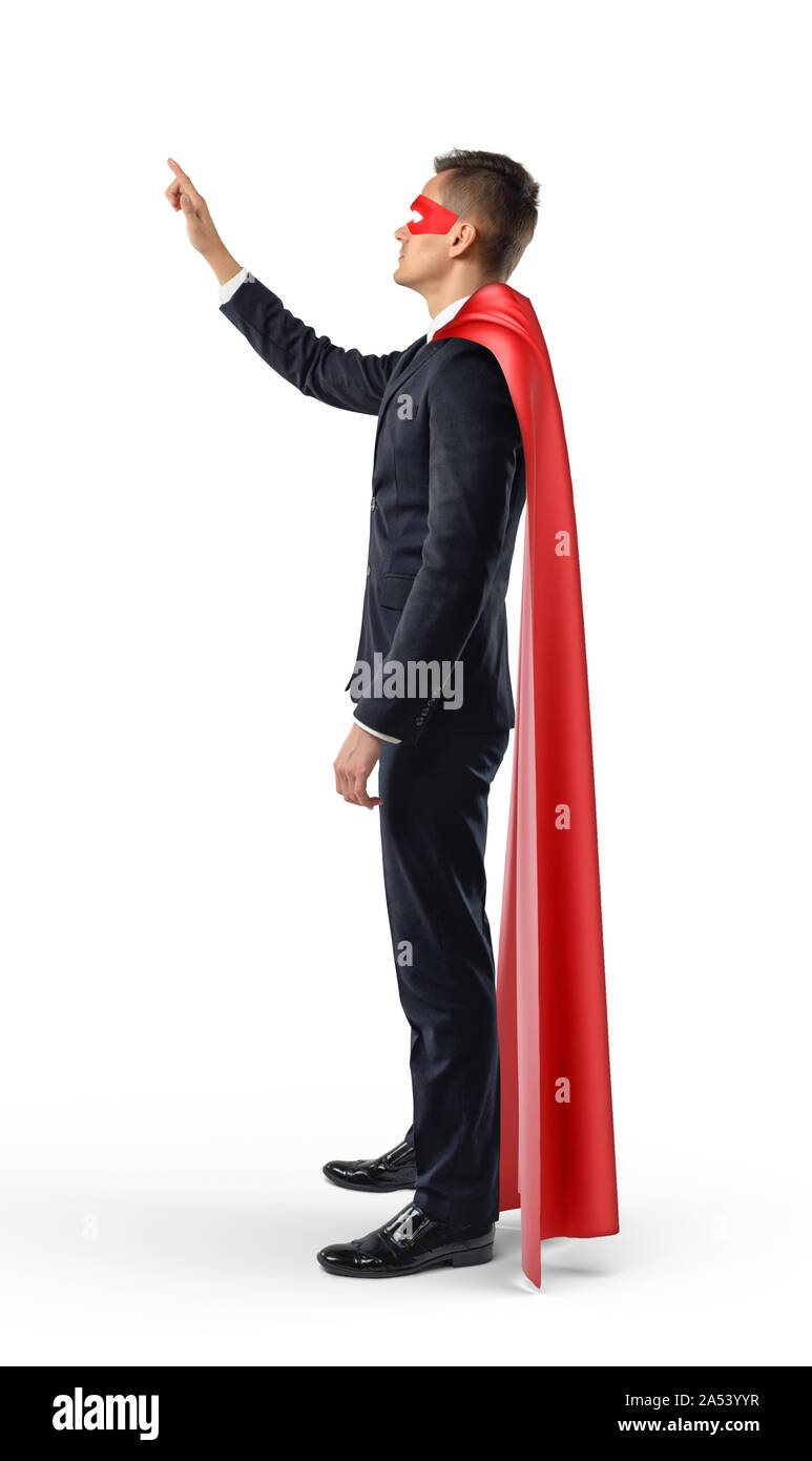 A businessman wearing a red superhero cape standing in side view and ...