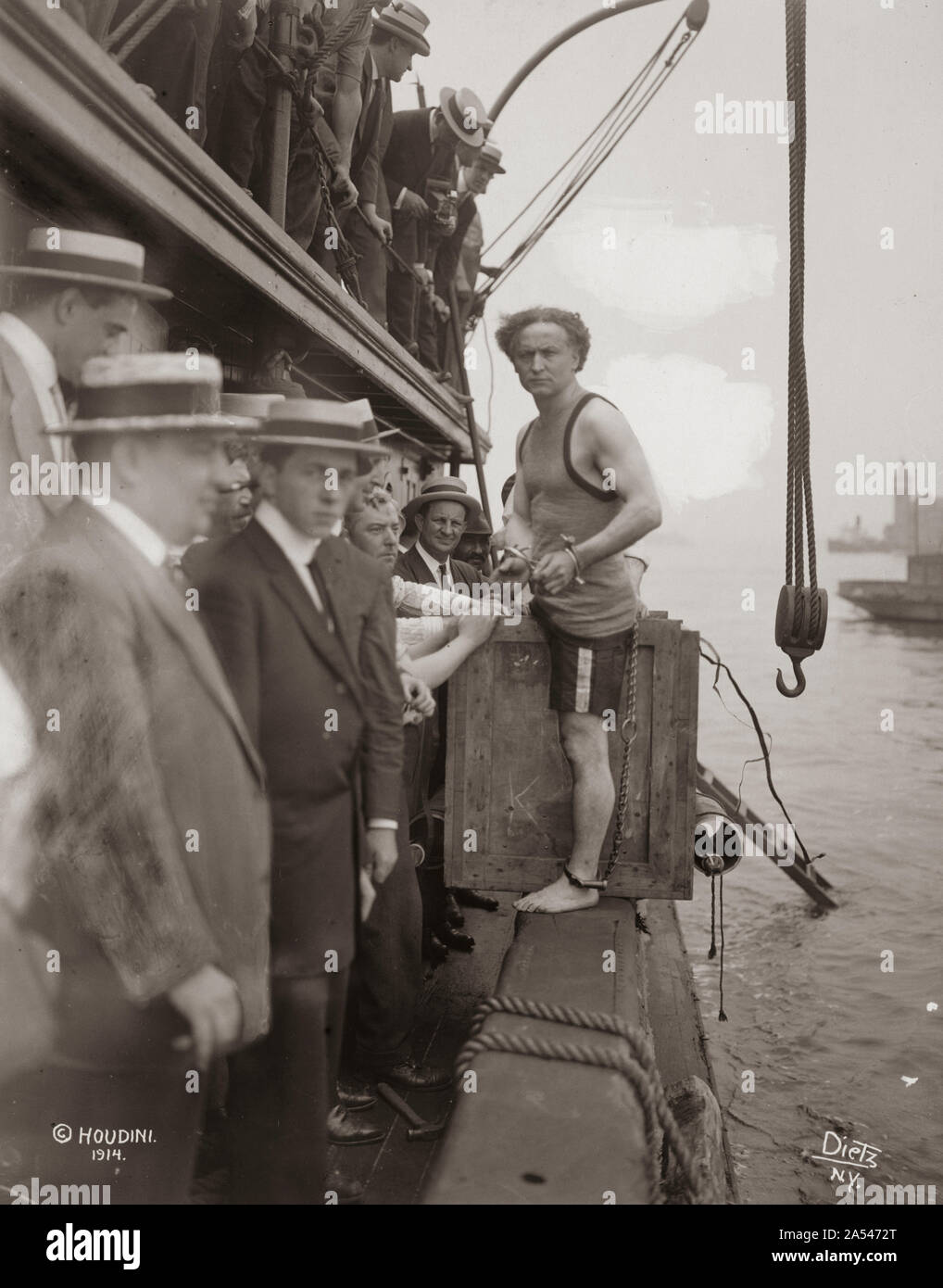 Magician and illusionist Harry Houdini about to enter a crate and ...