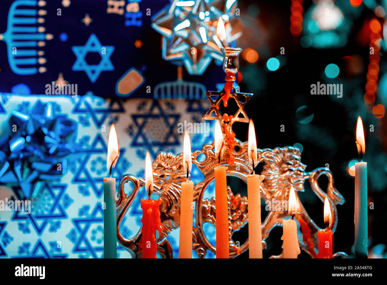 Lighting candles in menorah for Hanukkah in the Jewish Festival Stock ...