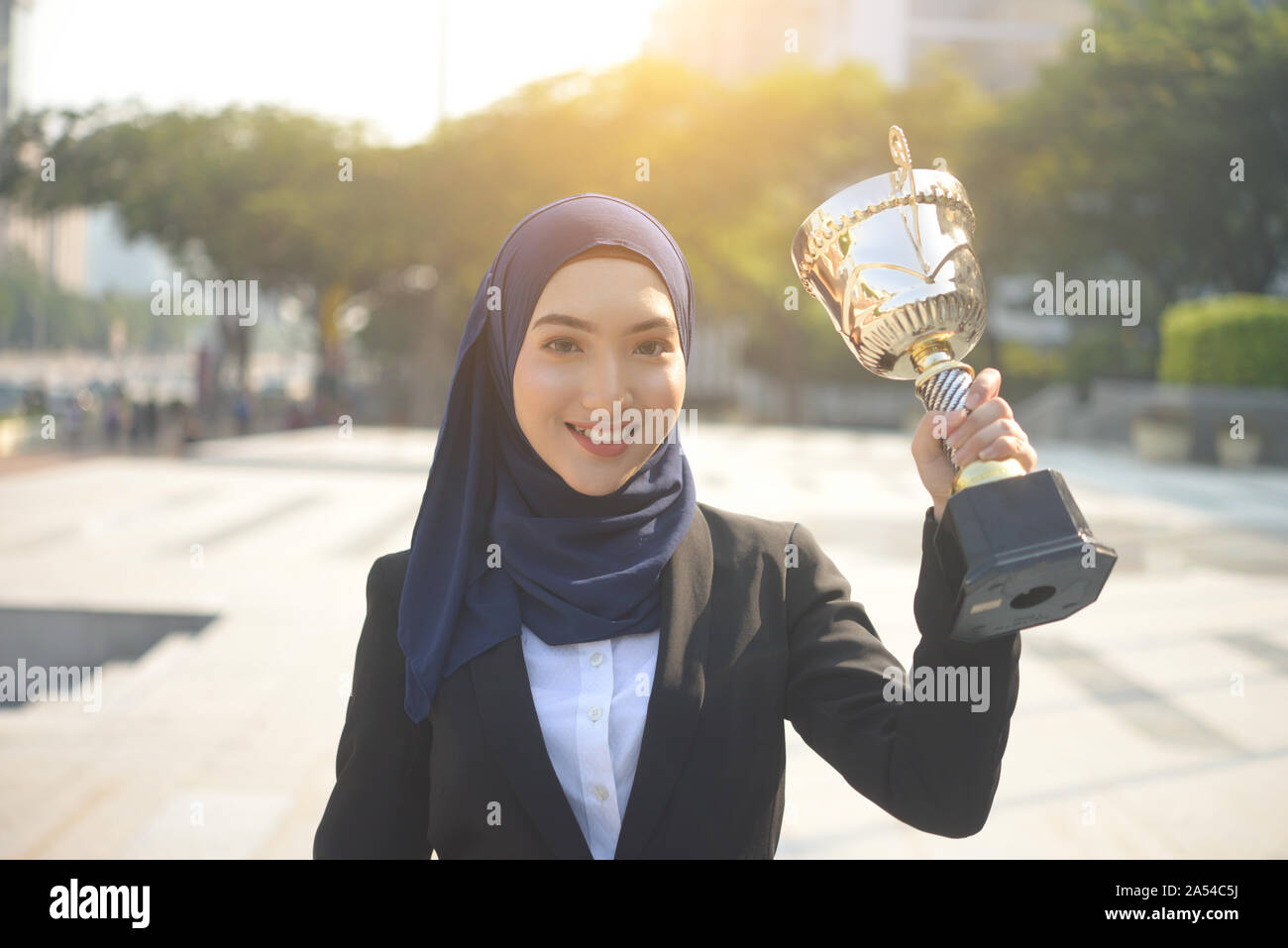 young muslim business woman celebrating success Stock Photo - Alamy